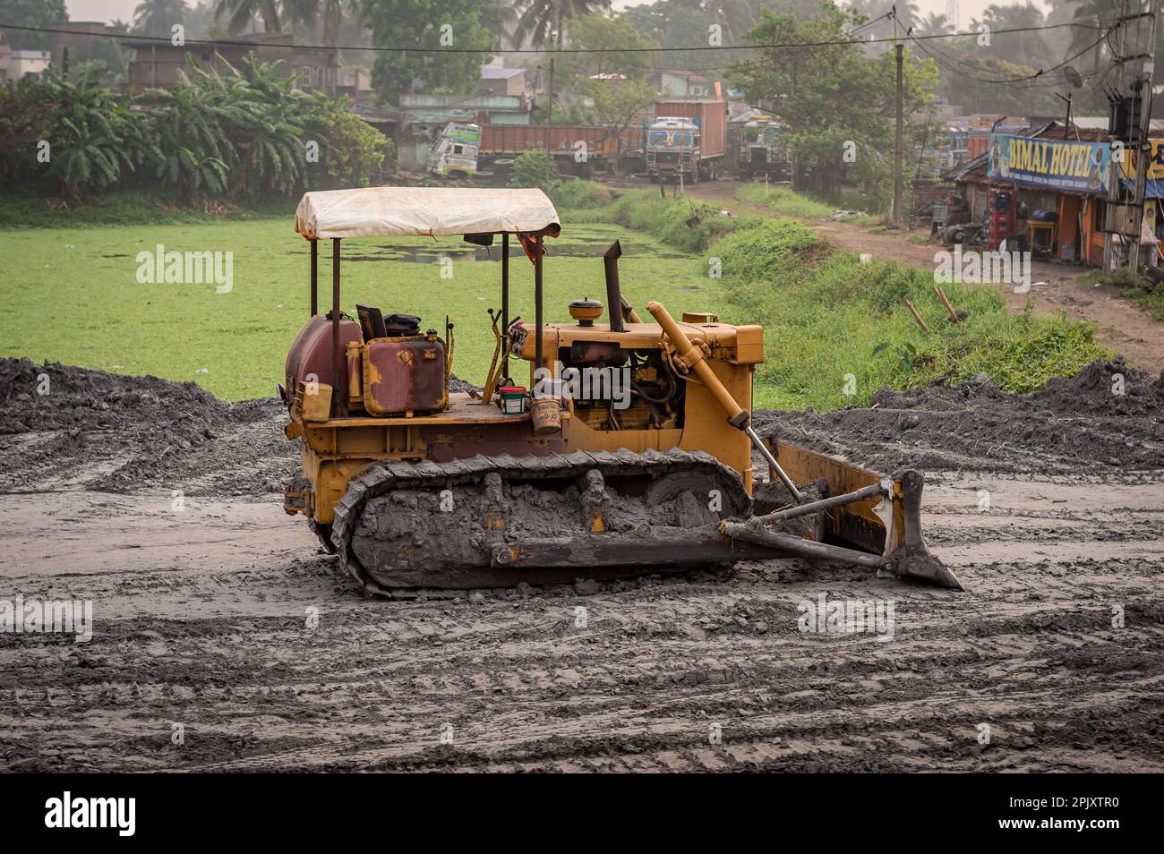 Bulldozer on road a construction site. Bardhaman West Bengal India ...