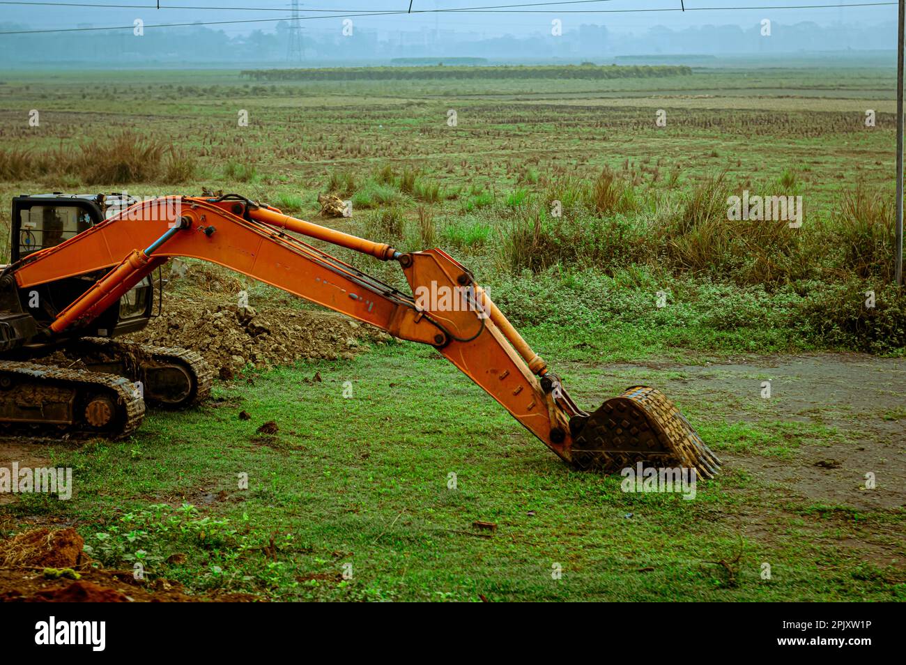 A backhoe loader excavator digger, a heavy industrial vehicle on a ...