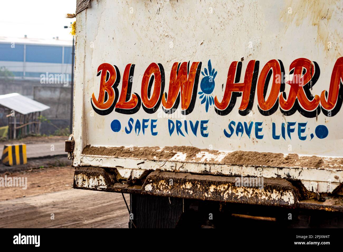 Blow Horn Safe Drive Save Life written on back of a car Stock Photo - Alamy