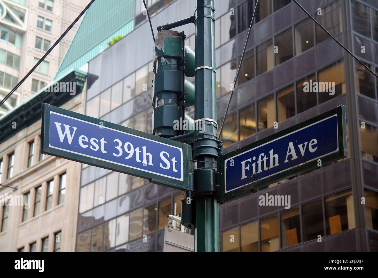 Blue West 38th Street and Fifth Avenue historic sign in midtown ...