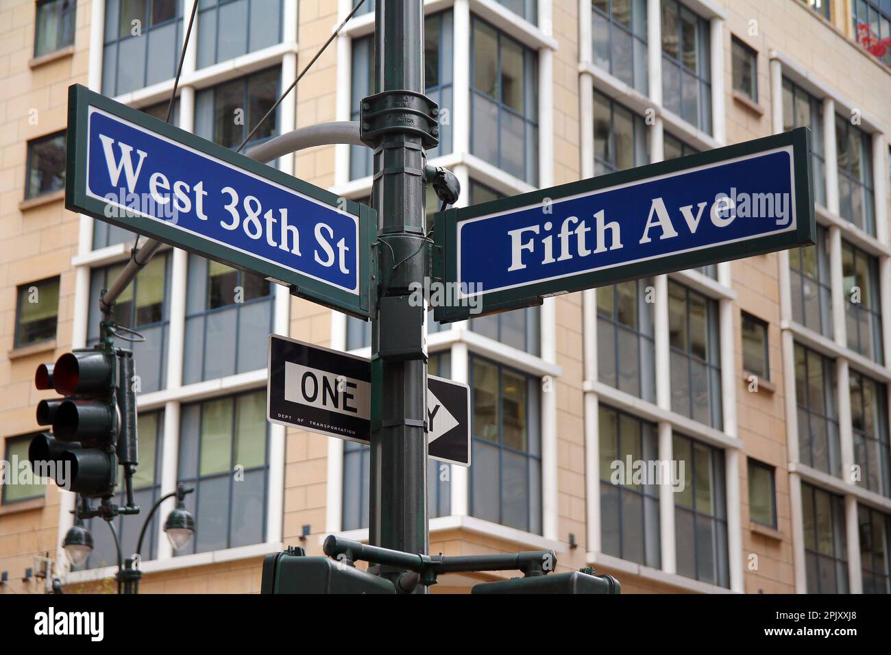 Blue West 38th Street and Fifth Avenue historic sign in midtown ...