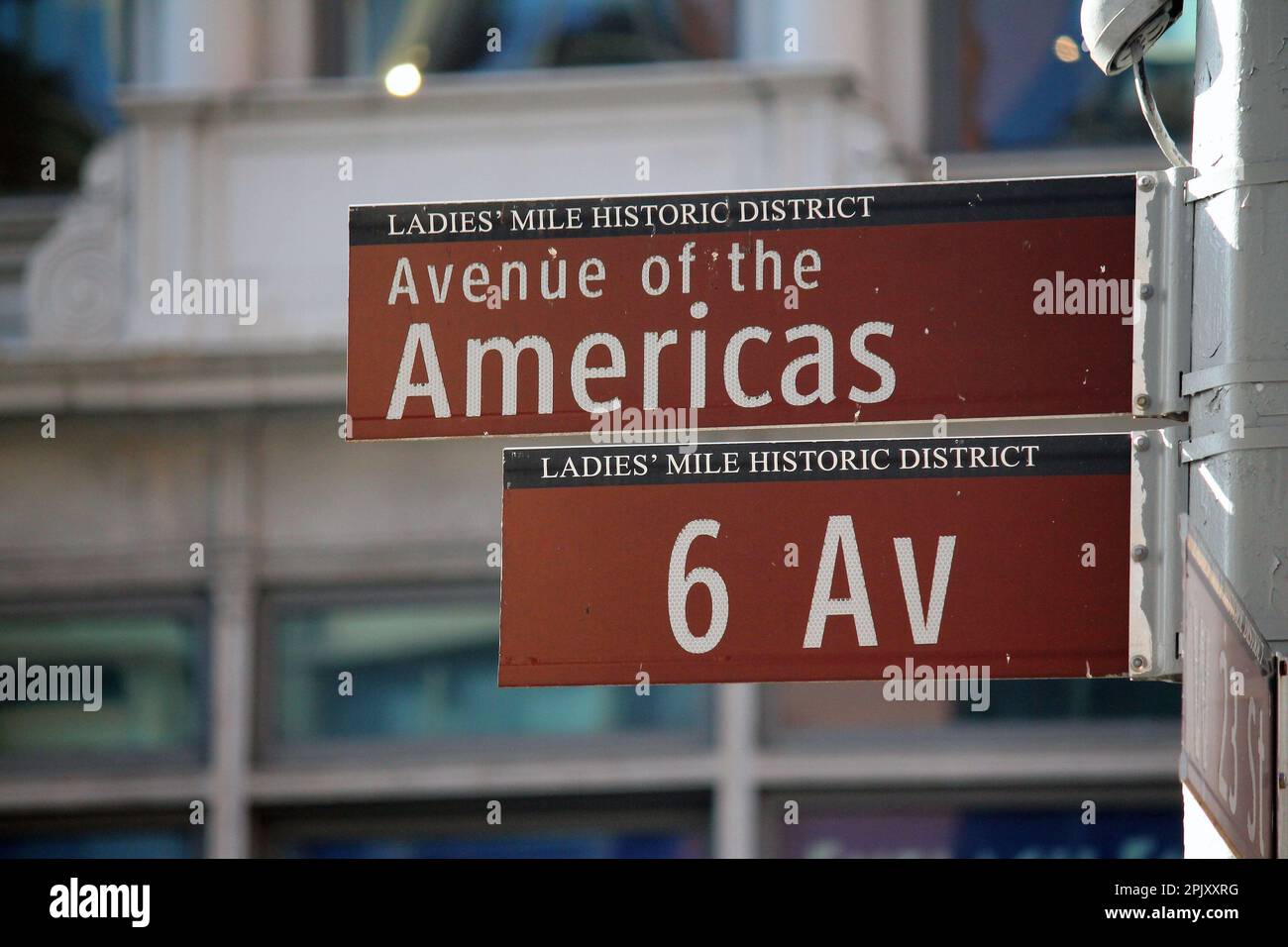 Avenue of the Americas 6 Av brown traffic sign in New York Stock Photo ...