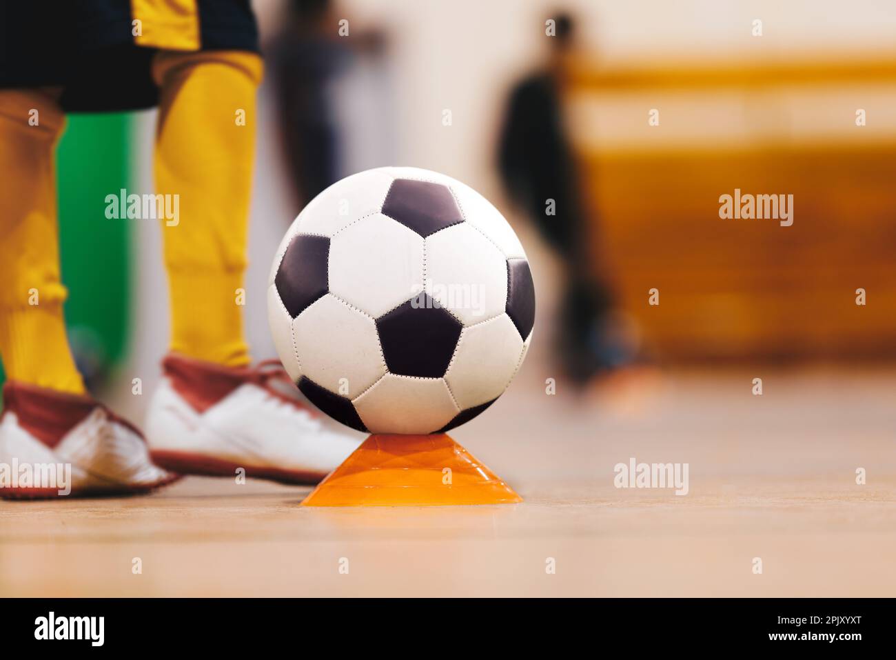 Youth futsal league. Indoor football player with classic soccer ball ...