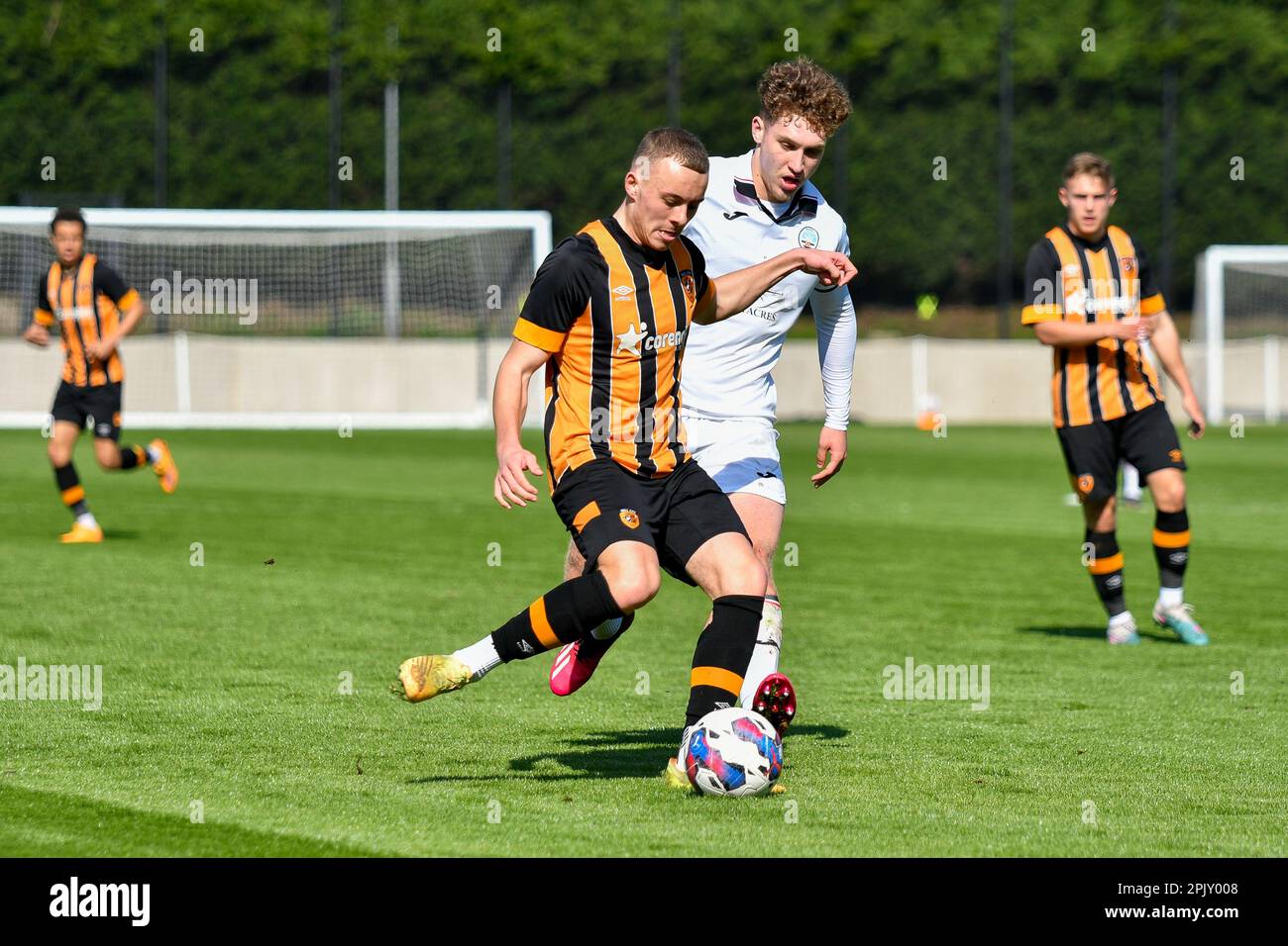 Swansea, Wales. 4 April 2023. Trialist of Hull City holds off the ...