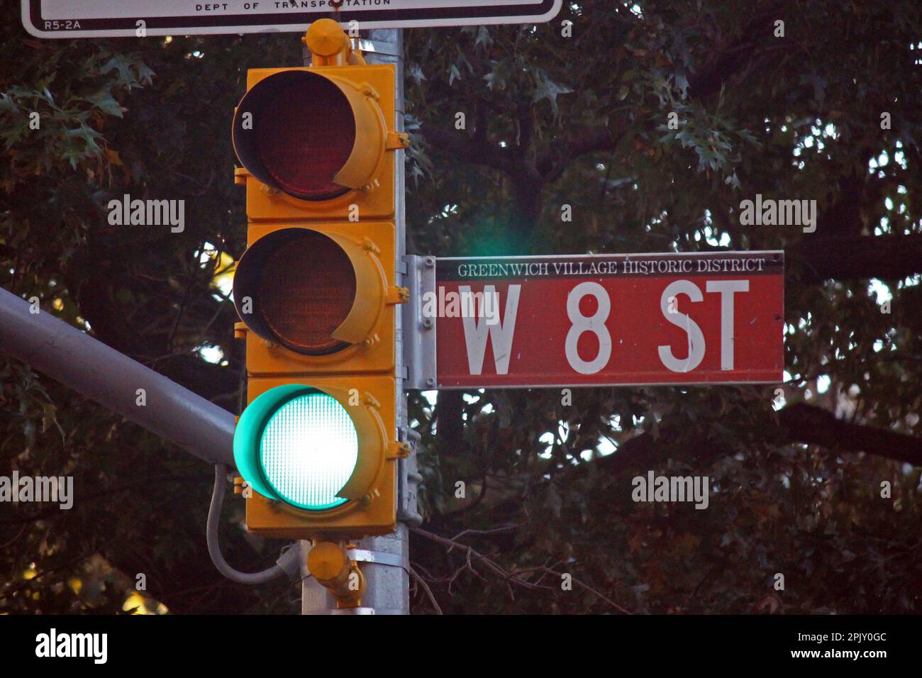 West 8th Street brown traffic sign in New York Stock Photo - Alamy
