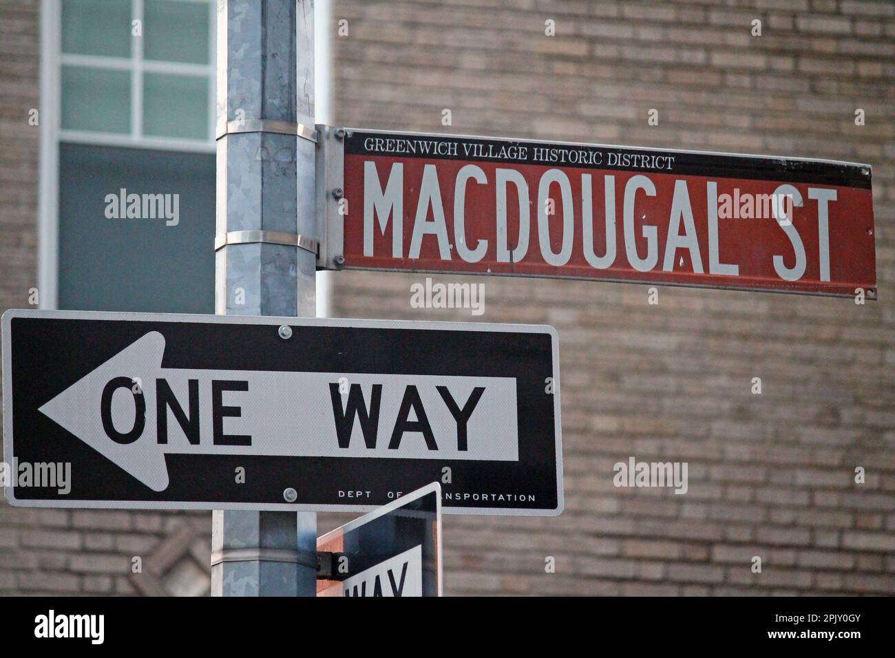 Macdougal Street brown traffic sign in New York Stock Photo - Alamy