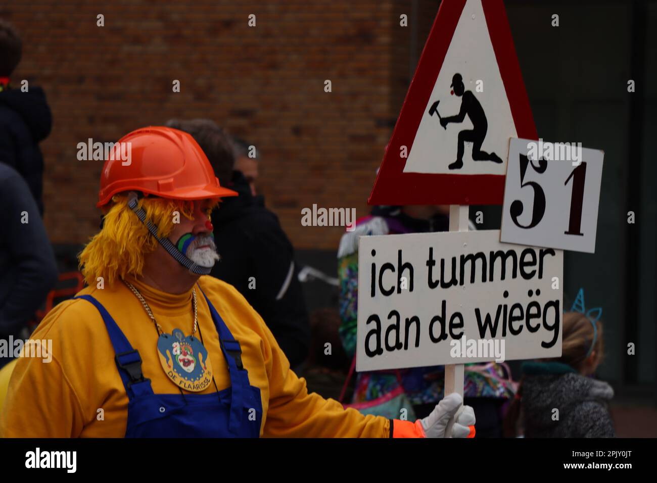A group of Dutch citizens celebrating the Rogstaekers parade with a ...