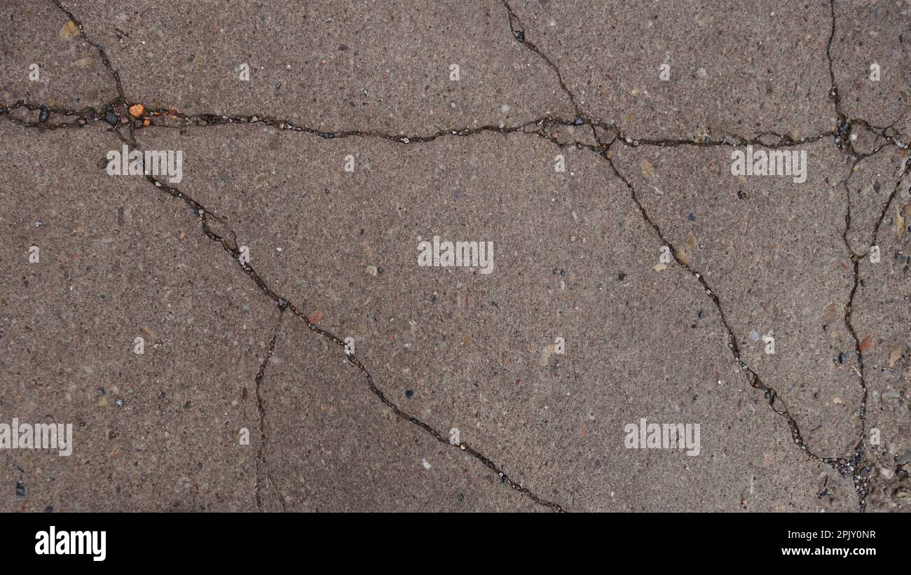 cracked wall or pavement Stock Photo - Alamy