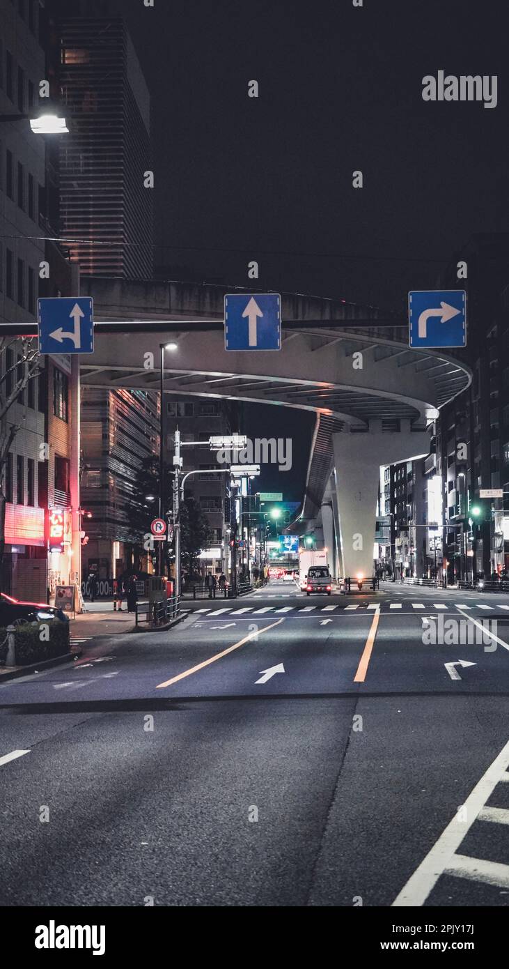 Empty street with street signs in Tokyo, Japan at night Stock Photo - Alamy