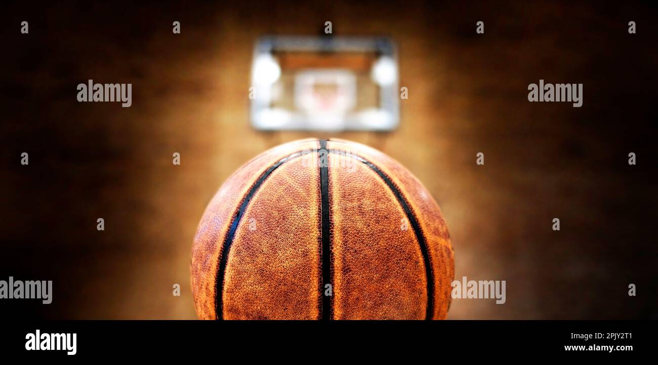 Basketball court with ball hoops rims hardwood floor and lights for ...