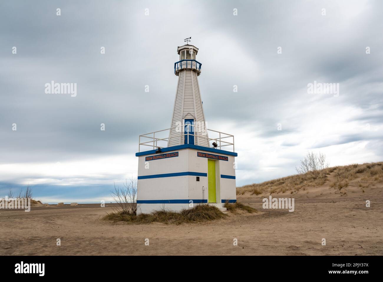 Lighthouse on the beach as storm clouds approach. New Buffalo, Michigan ...