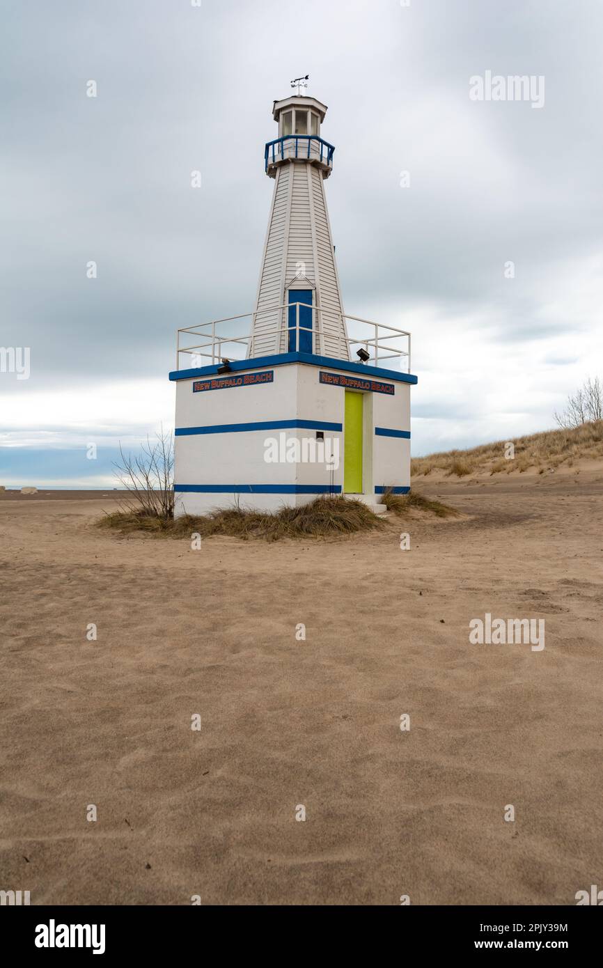 Lighthouse on the beach as storm clouds approach. New Buffalo, Michigan ...