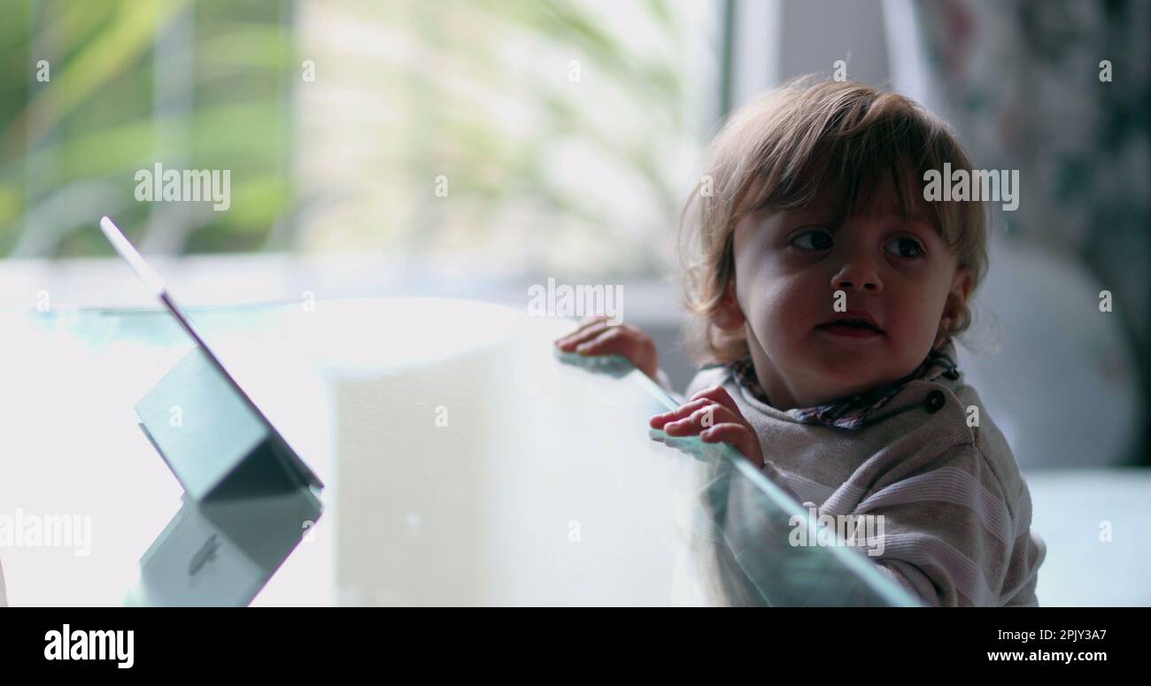 Child watching cartoon on tablet. Toddler baby pointing finger to screen Stock Photo - Alamy