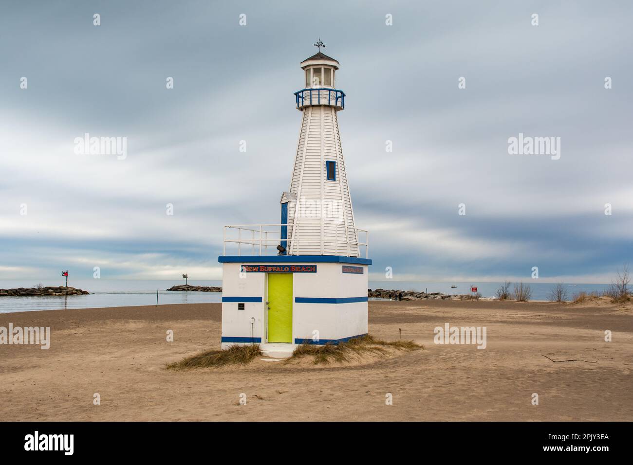 Lighthouse on the beach as storm clouds approach. New Buffalo, Michigan ...