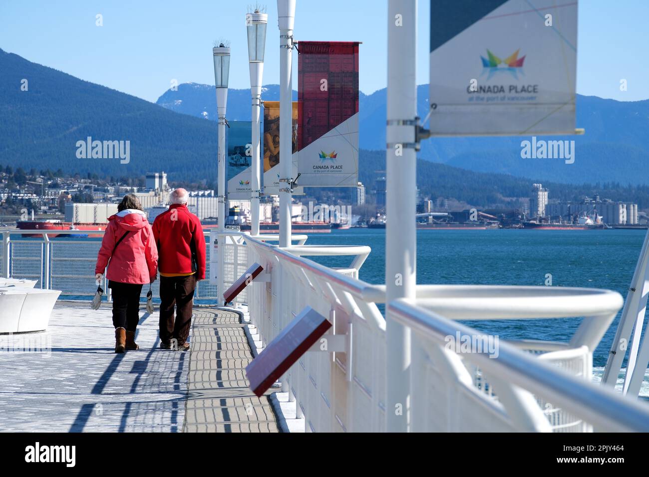 red warm jackets windbreakers hold hands love in old age elderly men ...