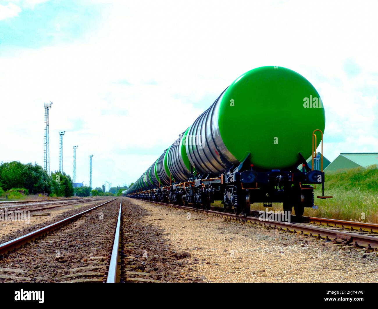 green ethanol freight train in railroad station. biofuel tanker ...