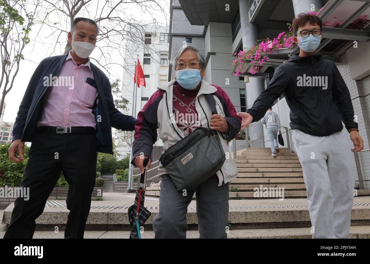 Chan Tak-ching (centre) leaves the Kowloon City Court with relative ...