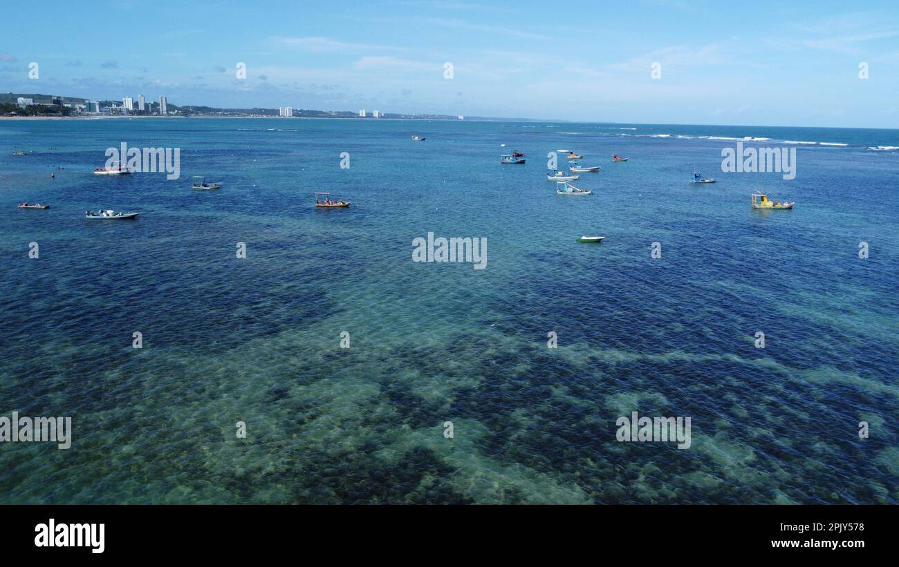 Aerial view of multiple boats and ships on the tranquil sea Stock Photo ...