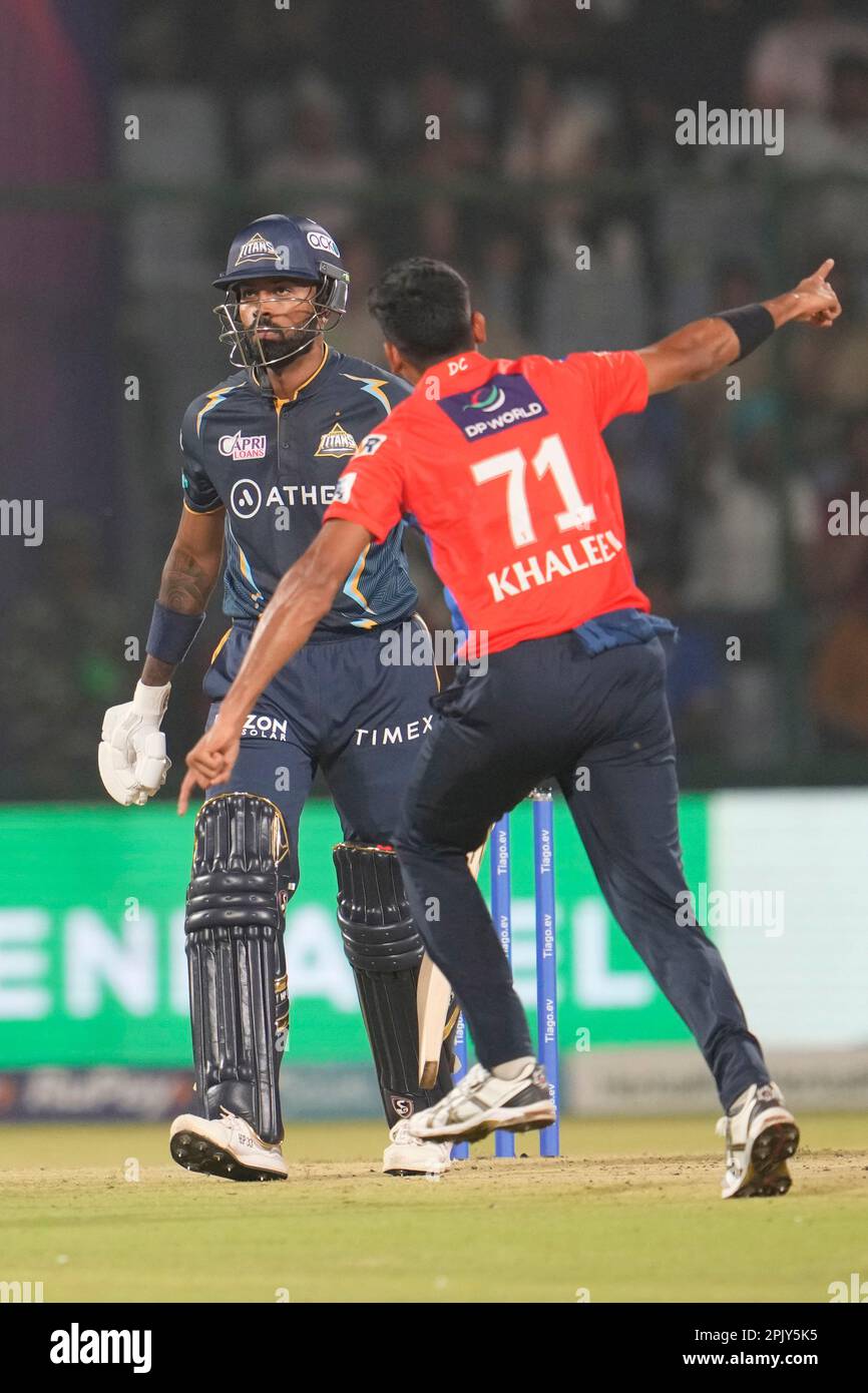 Gujarat Titans' captain Hardik Pandya, left, walk back to the pavilion ...