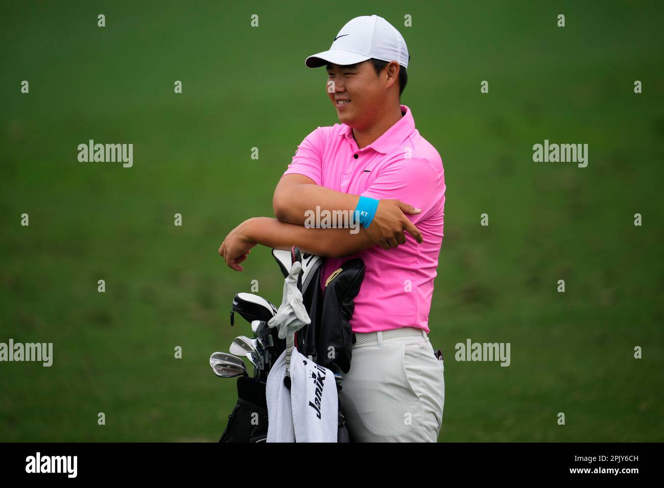 Tom Kim, of South Korea, works out on the range during a practice for ...