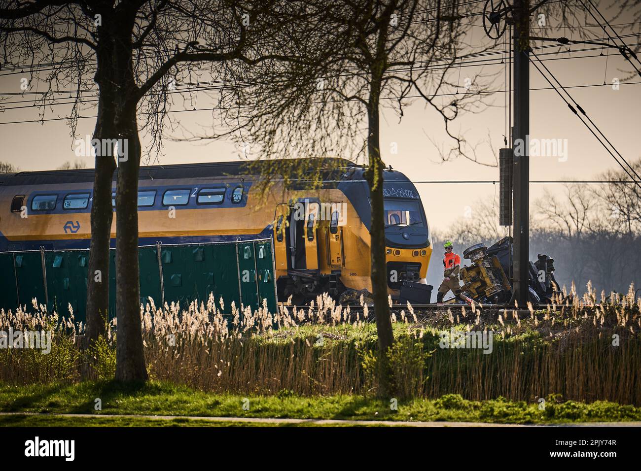 Voorschoten - Emergency services at work at a derailed night train. The ...