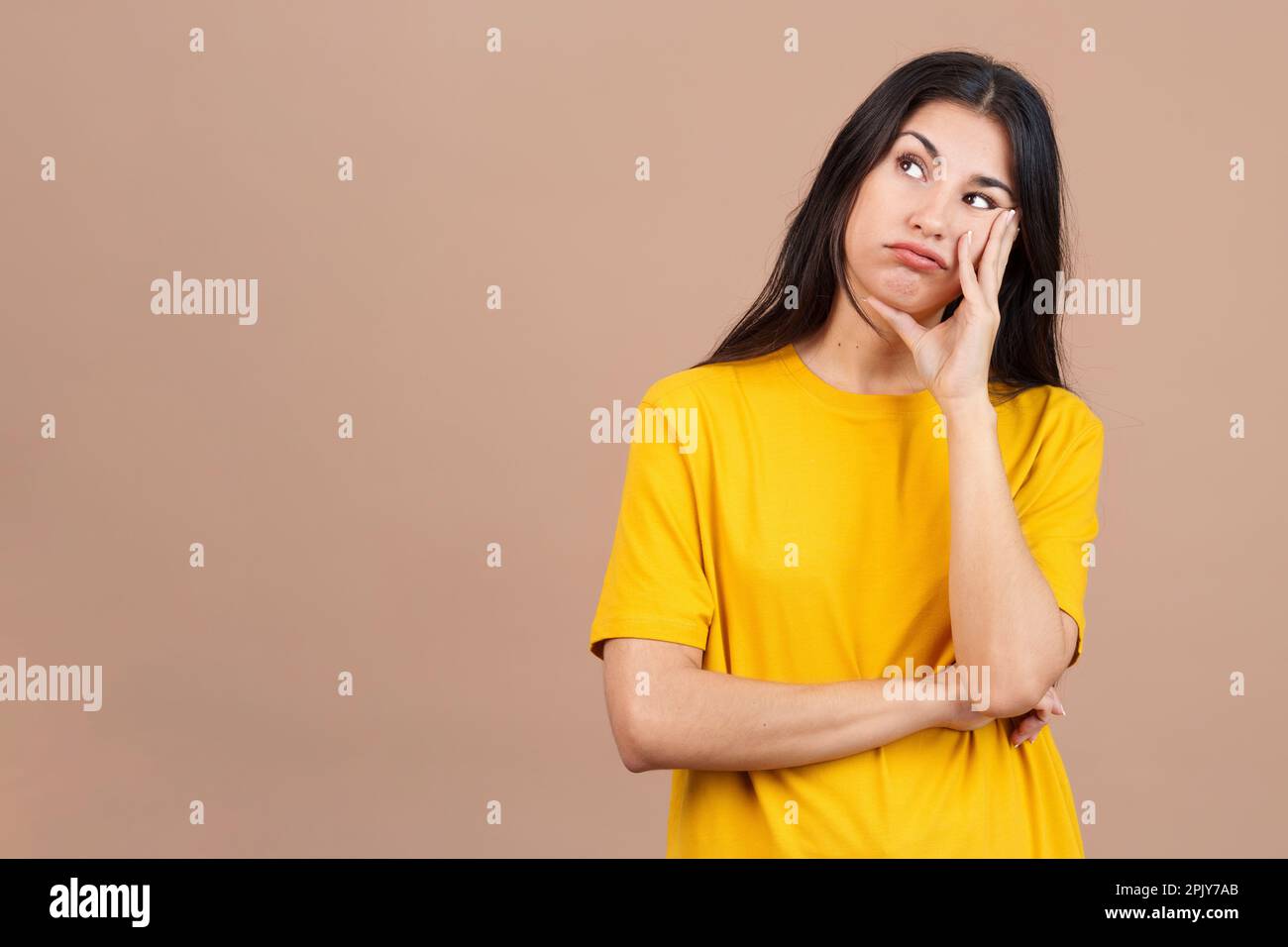 Bored caucasian woman standing and looking up Stock Photo - Alamy