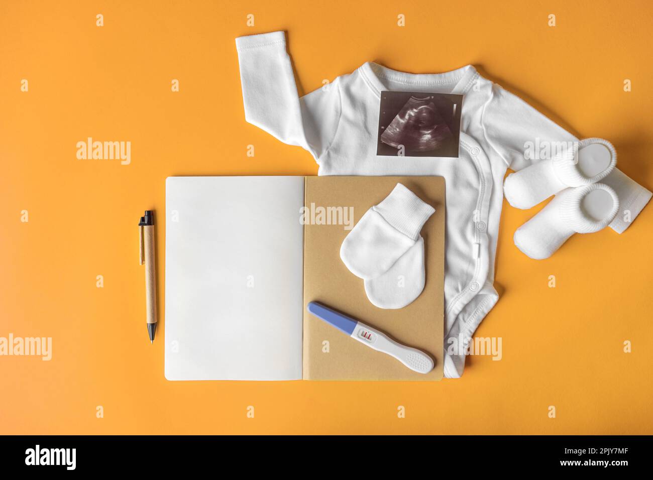 Filling out a notebook during pregnancy Stock Photo - Alamy