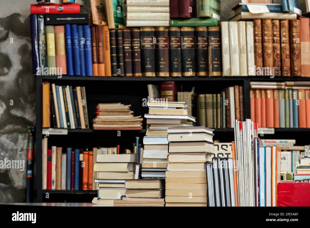Stacks of many old used books and magazines displayed at local ...