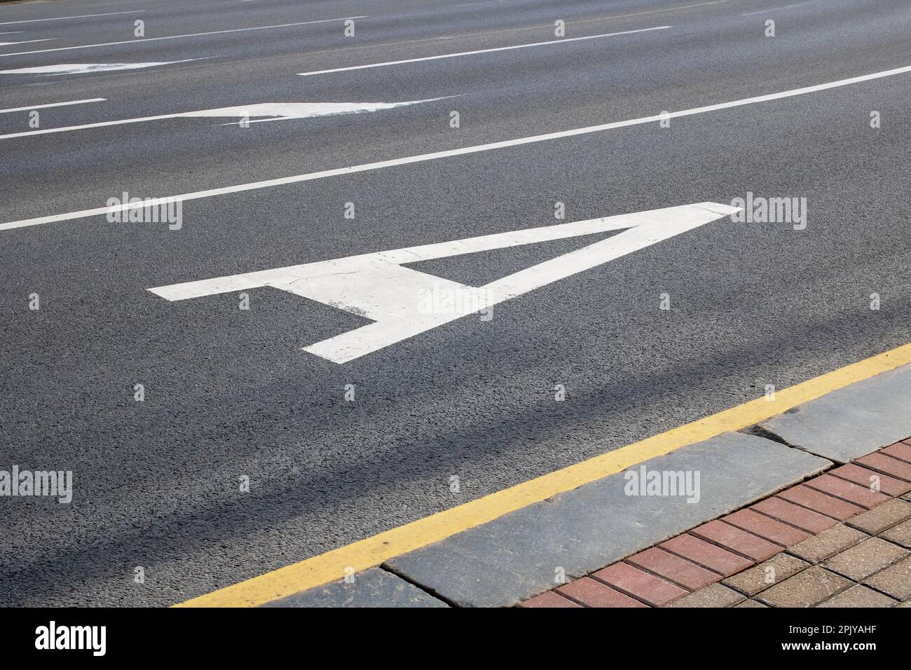 Symbol of the bus lane on the asphalt close up Stock Photo - Alamy
