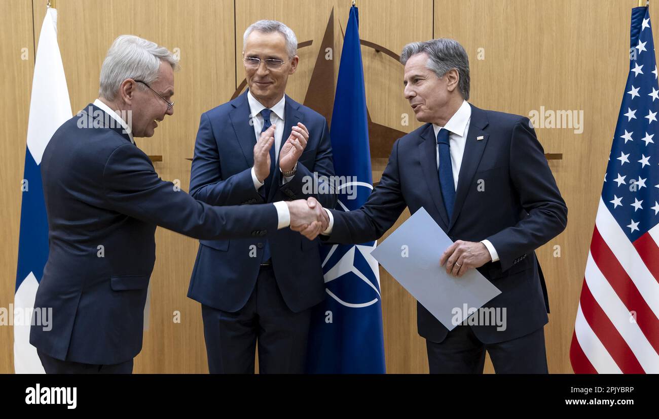 Finnish Foreign Affairs Minister Pekka Haavisto (L) hands over Finland ...