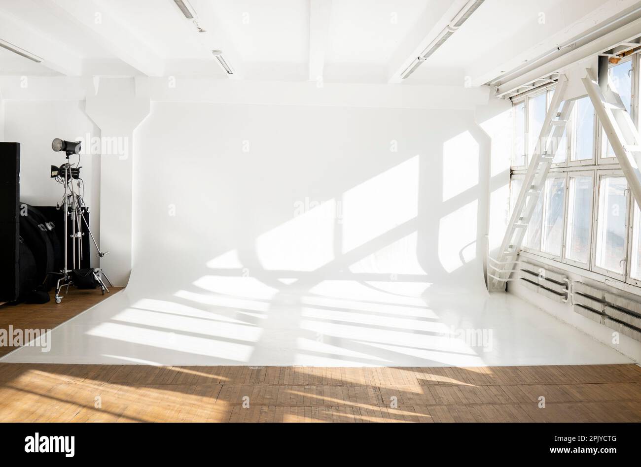 Large sunny photo studio with cyclorama and large panoramic windows ...