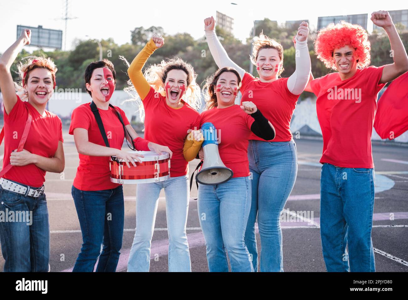 Sports fans together defending their team and cheering for it during ...