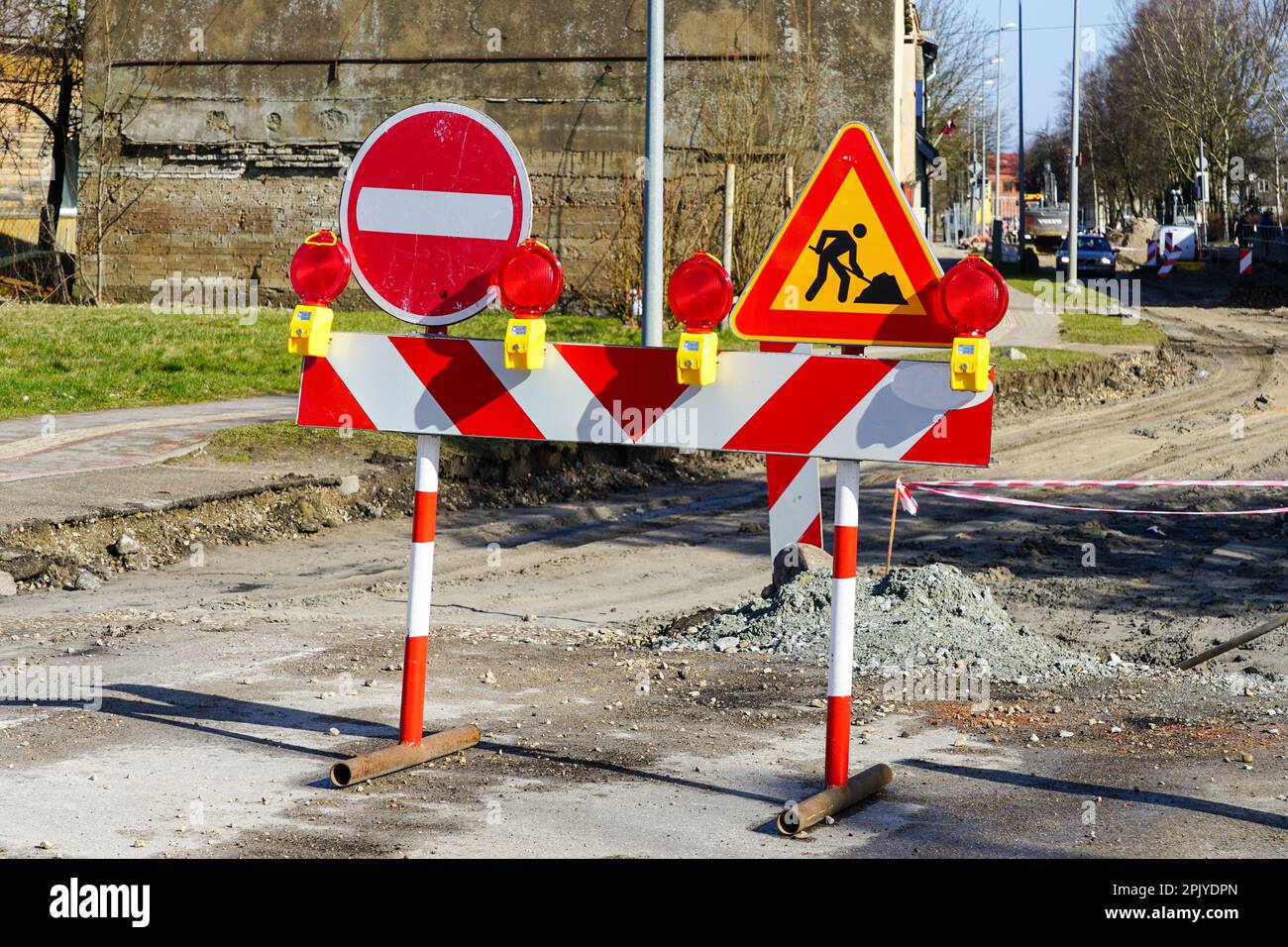 Red and white striped traffic warning barrier with red lights and ...