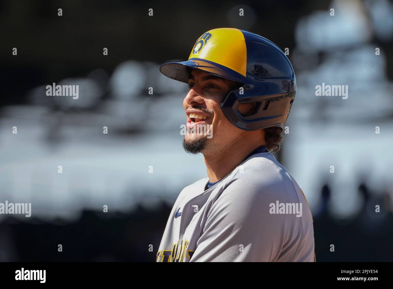 Milwaukee Brewers shortstop Willy Adames smiles at his teammates in the ...