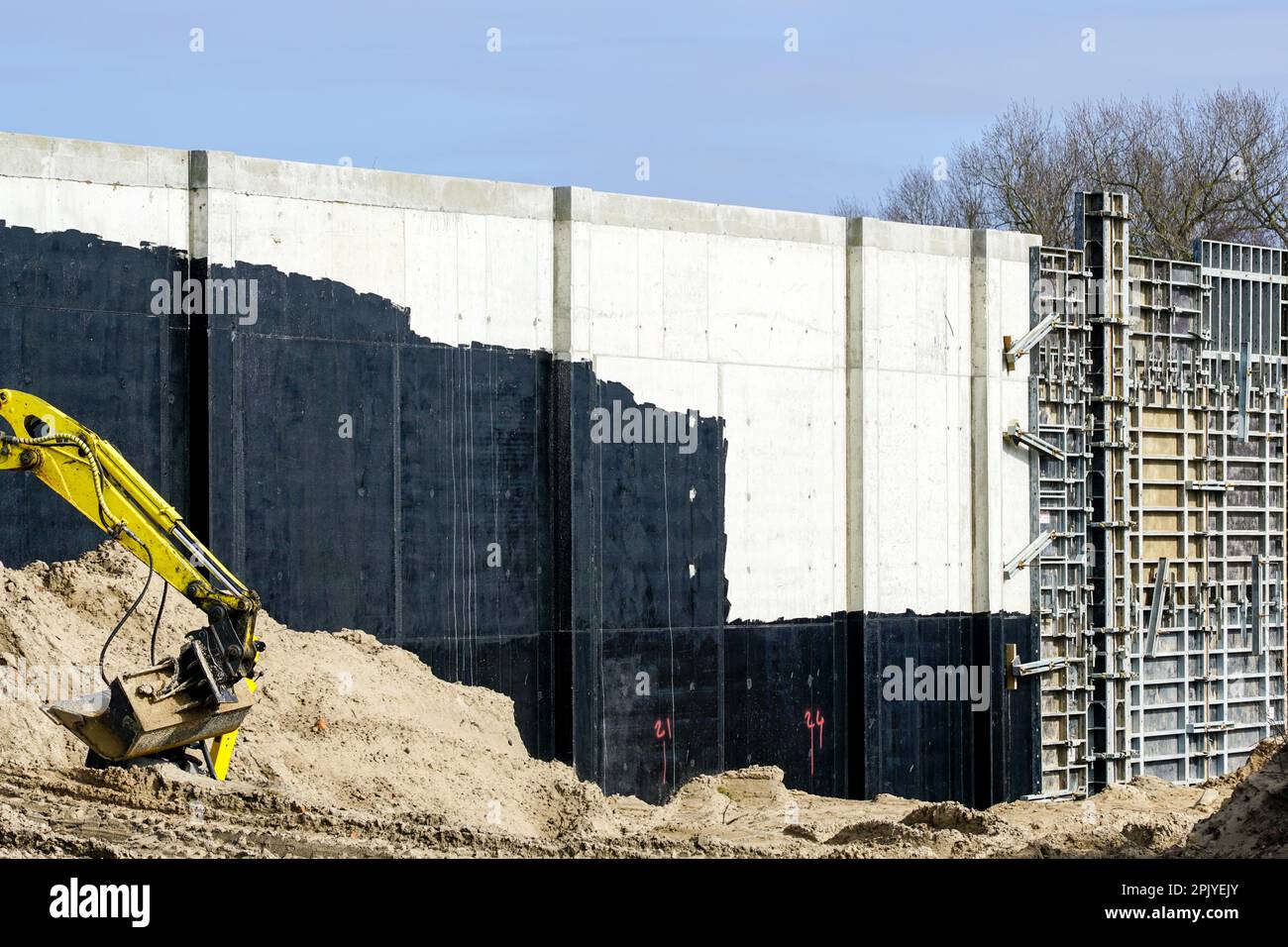 Concrete wall of a huge water reservoir built using concrete formwork ...