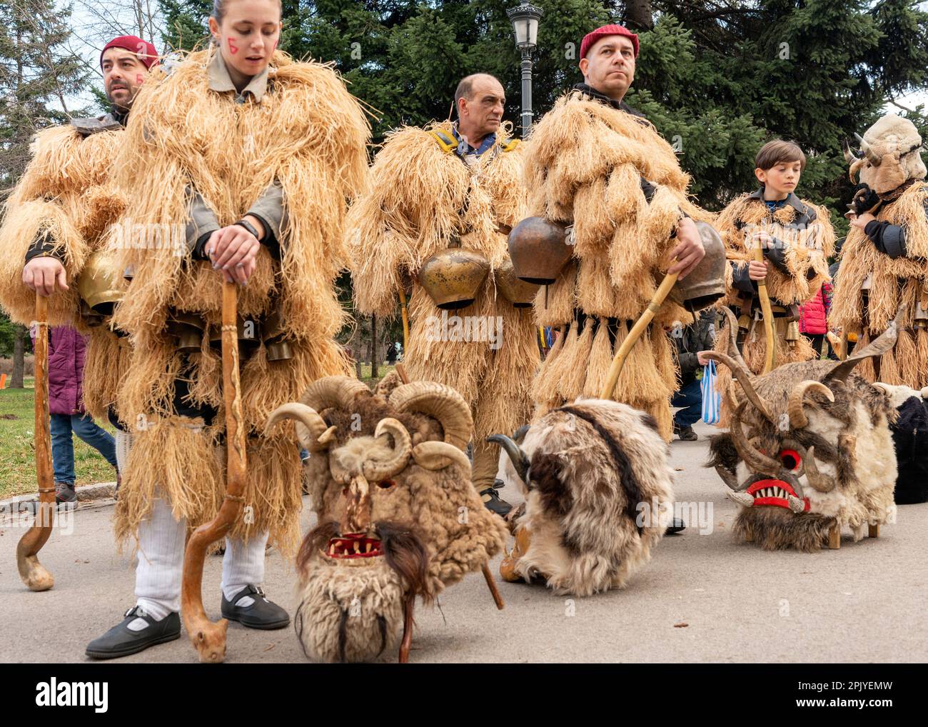 Group of Kukeri dancers with intricate costumes and large bells waiting ...