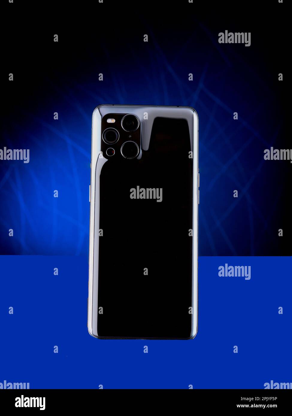 Luxury smart phone with its cameras showing on a blue gradient ...