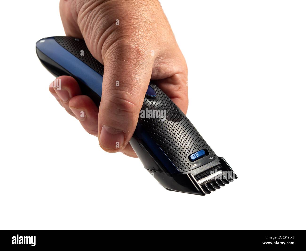 Hair clipper in hand isolated on white background. Modern hair clipper ...