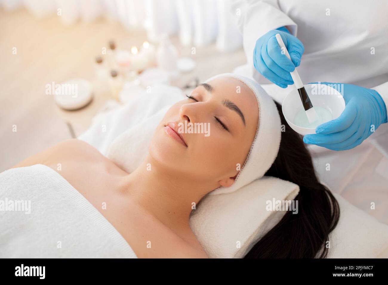 Relaxed indian woman getting skin treatment at modern spa salon Stock ...