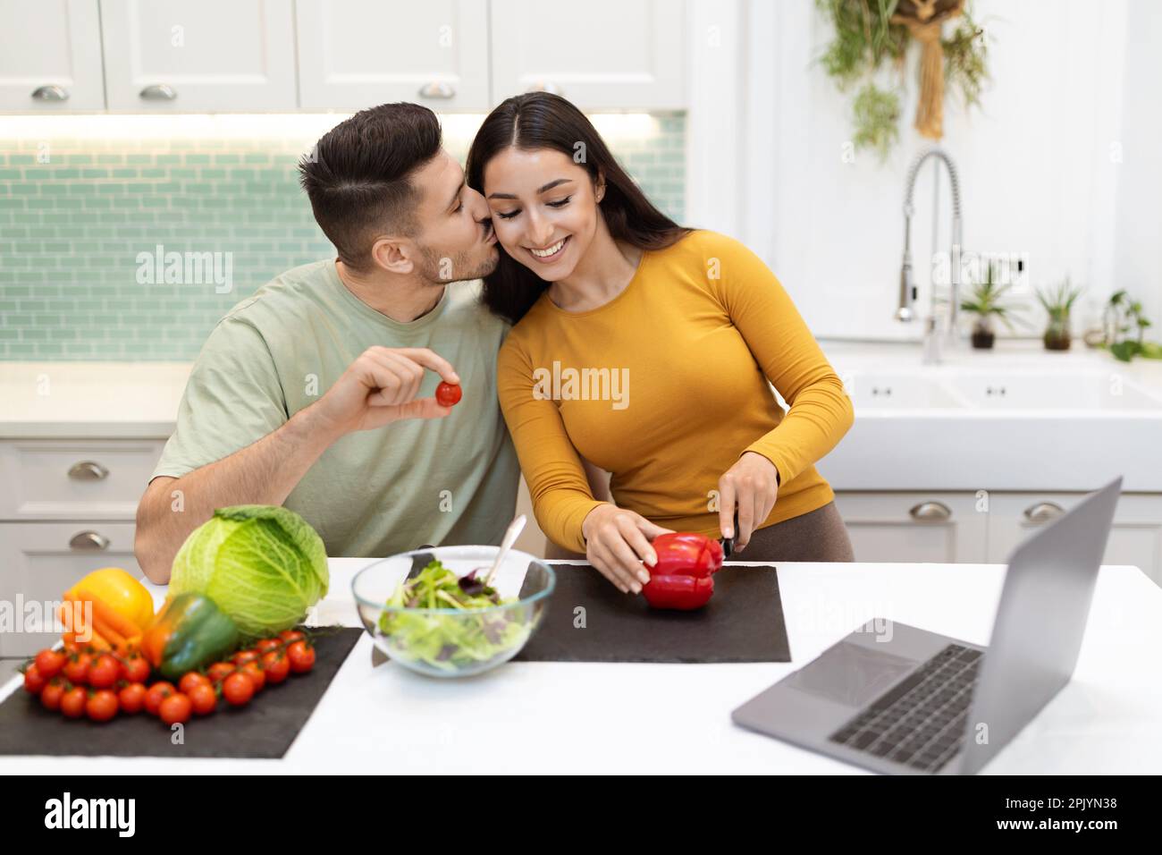 Husband helping wife computer home hi-res stock photography and images ...