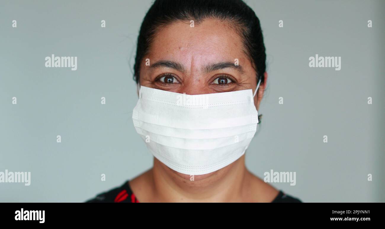 African black woman removing face mask against virus Stock Photo - Alamy