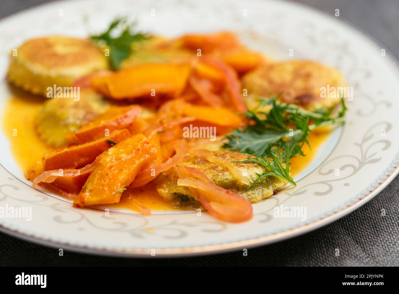 Home made ravioli with a rucola pesto with an red kuri squash and ...