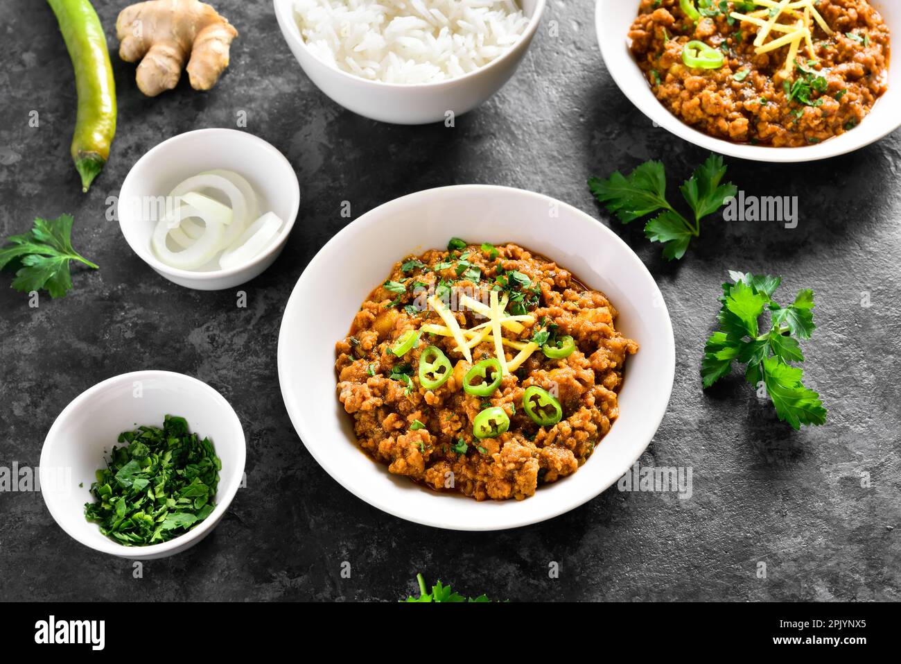 Keema curry in bowl over dark stone background. Indian and pakistani ...