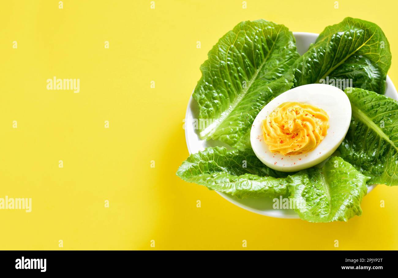 Deviled egg with paprika, mustard and mayonnaise. Appettizer for ...