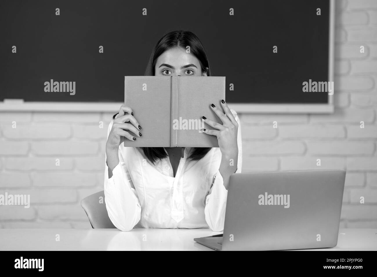 Beautiful student, cute young woman in class at school. Female college ...