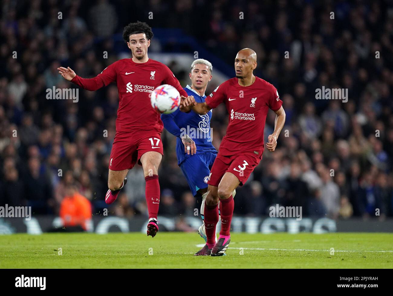 Chelsea's Enzo Fernandez with Liverpool's Curtis Jones (left) and ...