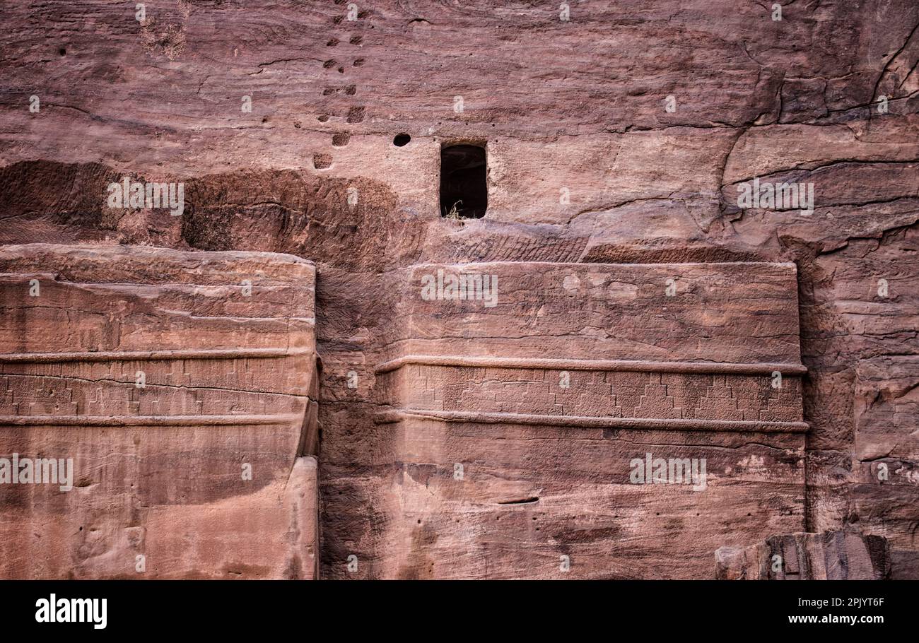 One of many historic hand carved caves in the valley of Petra. Jordan ...
