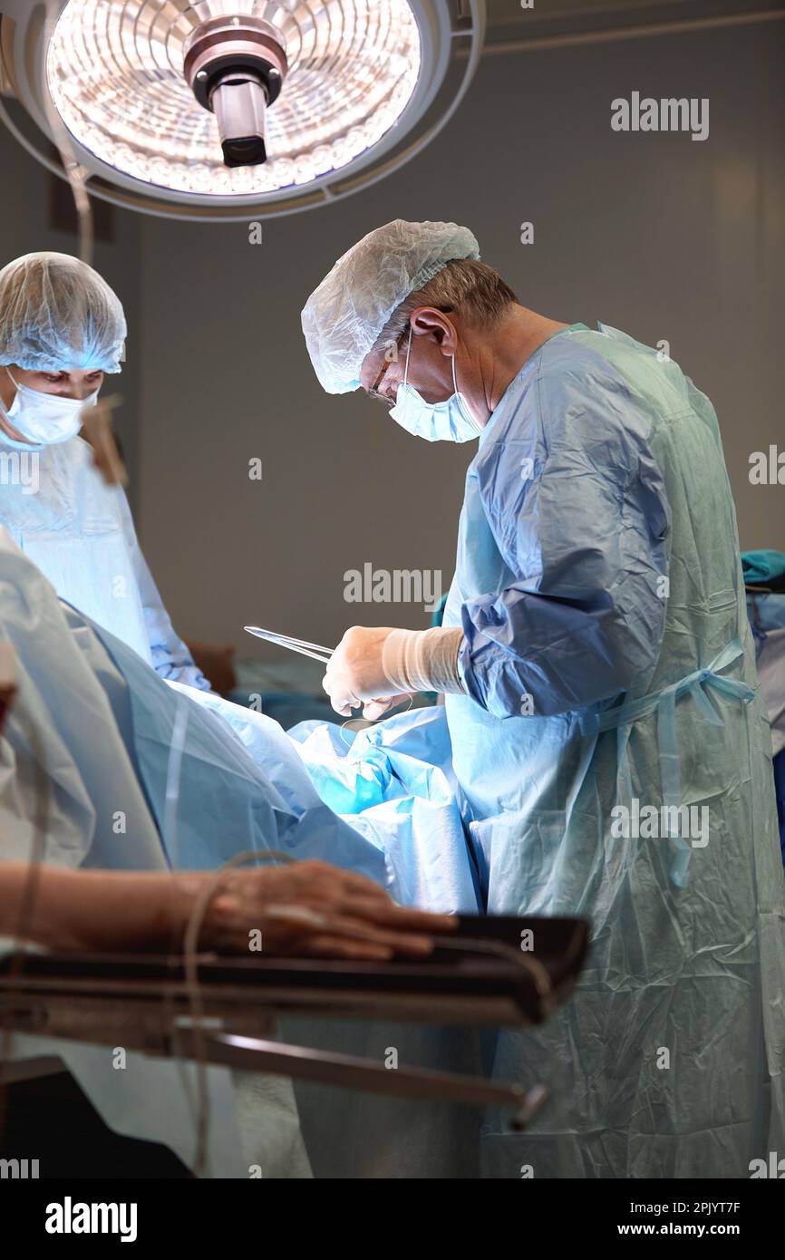 Nurse performing a cure to a patient hi-res stock photography and ...