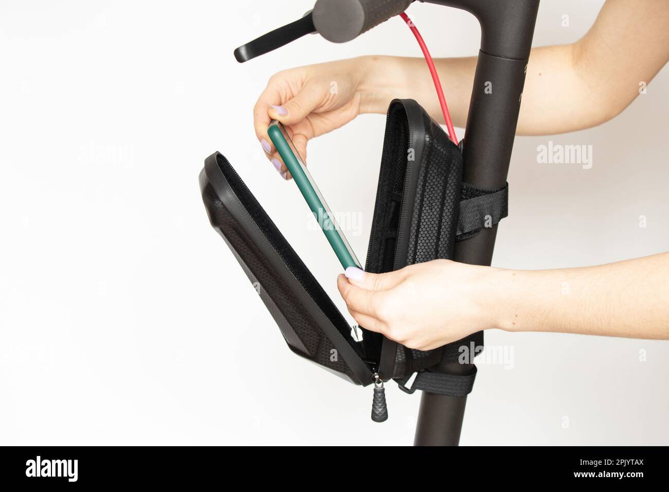 The glove box of the bag on the frame of the electric scooter and the ...