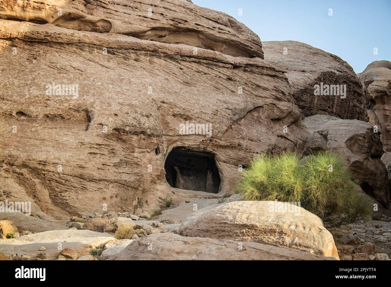 One of many historic hand carved caves in the valley of Petra. Jordan ...